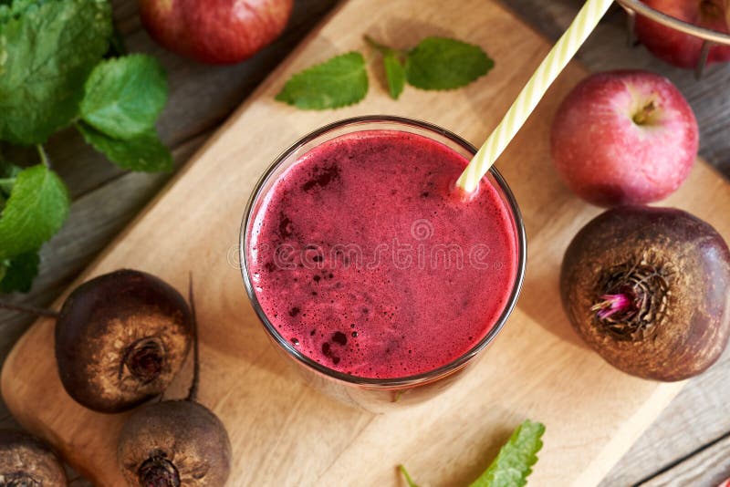 Red Beet Juice in a Glass, with Fresh Apples, Beetroot and Melissa in ...