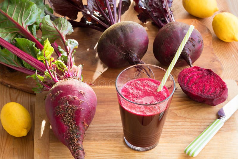 Red Beet Juice in a Glass with Beets and Lemons Stock Image - Image of ...