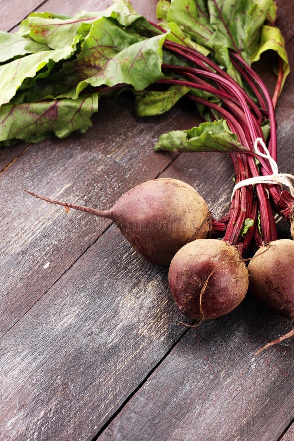 Red Beetroot with Herbage Green Leaves on Rustic Background. Org Stock ...
