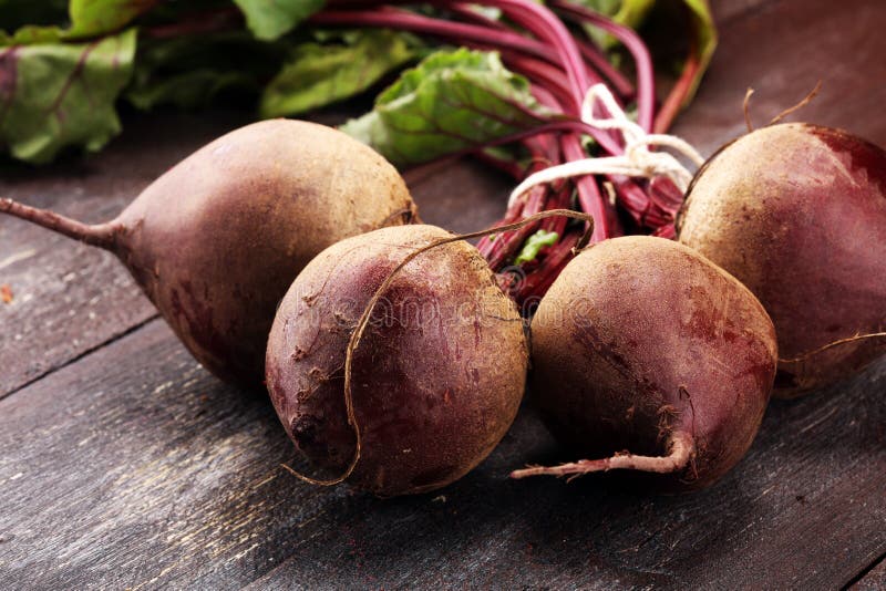 Red Beetroot with Herbage Green Leaves on Rustic Background. Org Stock ...