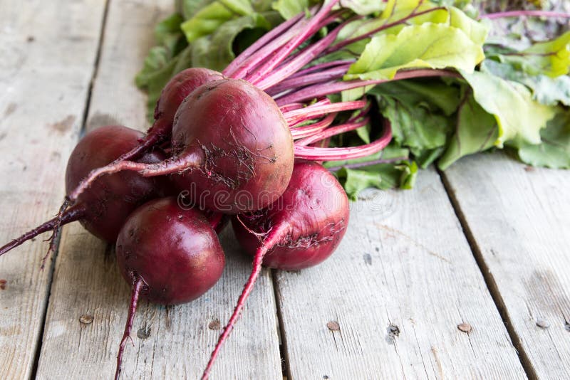 Red Beetroot with Herbage Green Leaves on Rustic Background. Org Stock ...