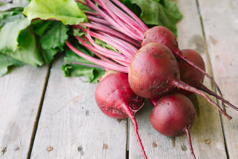 Red Beetroot with Herbage Green Leaves on Rustic Background. Org Stock ...