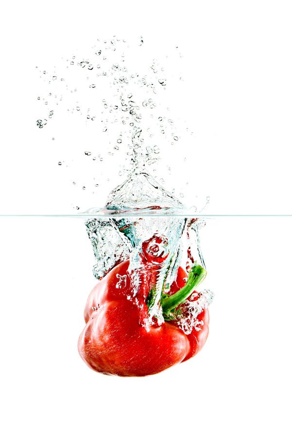 Red Bell Pepper Falling into Water Splash on a White Background Stock ...