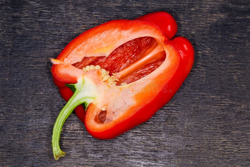 Red Bell Pepper Half, Cut Lengthwise on Dark Surface Stock Photo ...