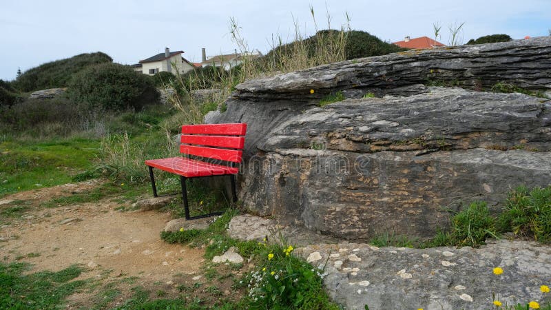 Red Bench in Front of a Huge Rock Stock Photo - Image of nature, floral ...