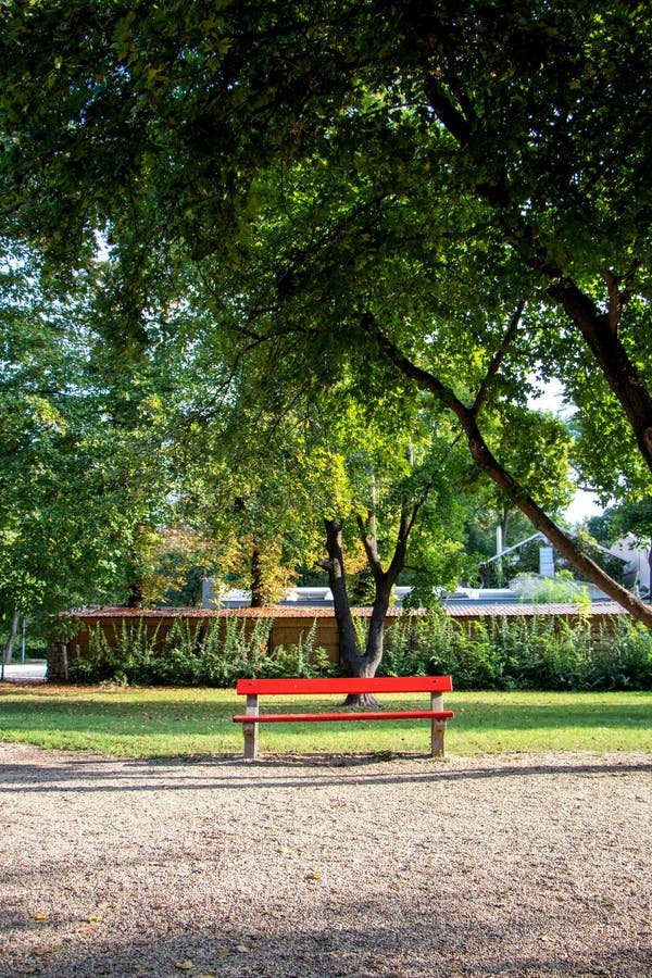 Red bench in the park stock image. Image of landscape - 158367931