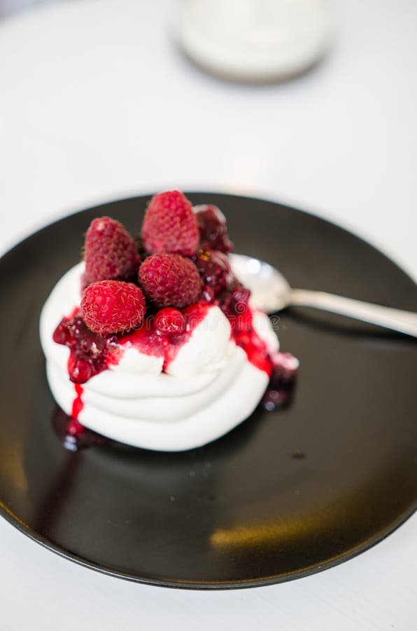 Red berries pavlova stock image. Image of spoon, plate - 44827745