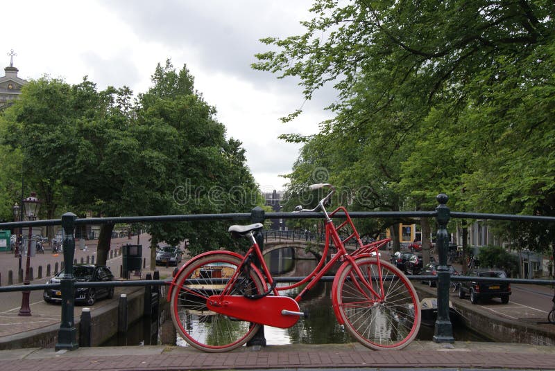 Red Bicycle on Amsterdam Bridge Over Canal Editorial Photography ...