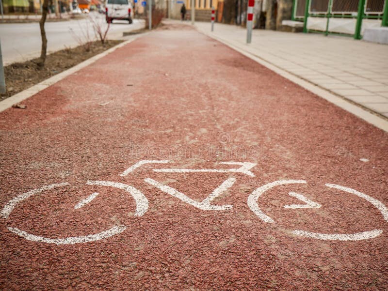 Red Bicycle Path Near Roadside, Focus on the Foreground Stock Image ...