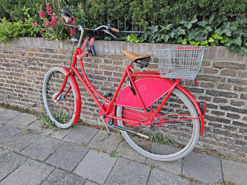 Red Bike Against a Wall in Amsterdam the Netherlands Stock Image ...