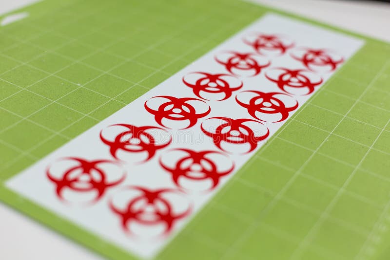 Red Biohazard Vinyl Stickers on Green Matt Made Using a Cutting Machine ...