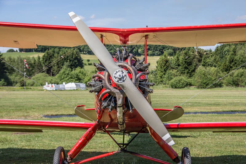 Red Biplane Airplane on Meadow Stock Photo - Image of green, brown ...
