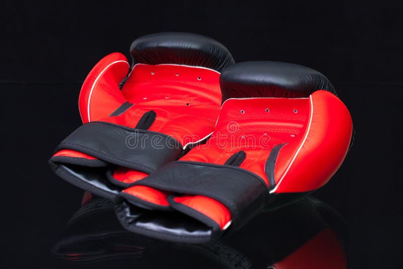 Red and Black Boxing Gloves on Black Glass Desk Stock Image - Image of ...