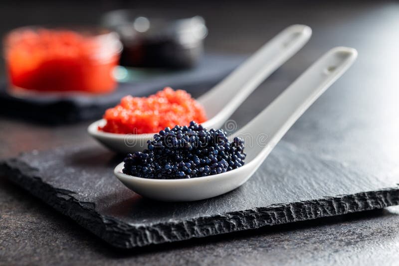 Red and Black Caviar in Ceramic Spoon on Dark Table Stock Image - Image ...