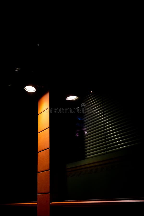 Red on Black Image of Modern Building Exterior or Facade at Night with ...