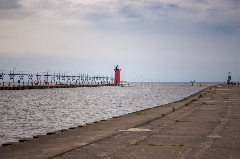 Lighthouse at end of pier stock image. Image of black - 125120869