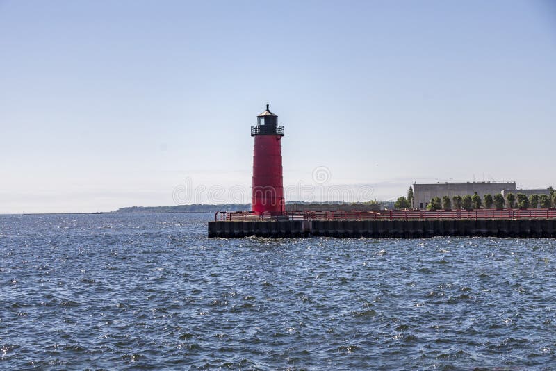 Red and Black Lighthouse on a Jetty on a Lake Stock Image - Image of ...
