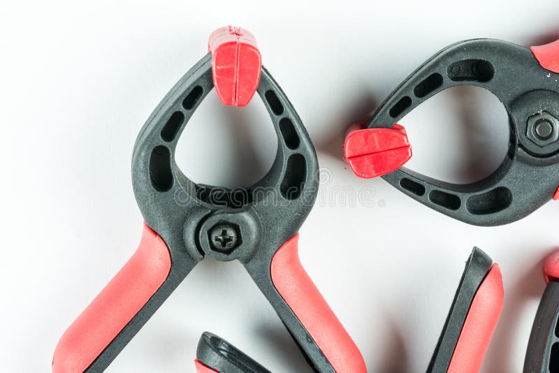 Plastic Carpenters Pinch Tool in the Hand Above White Background with ...