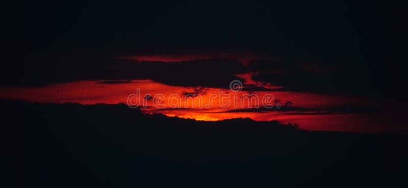 Red and black sunset stock photo. Image of sunset, orange - 68693372