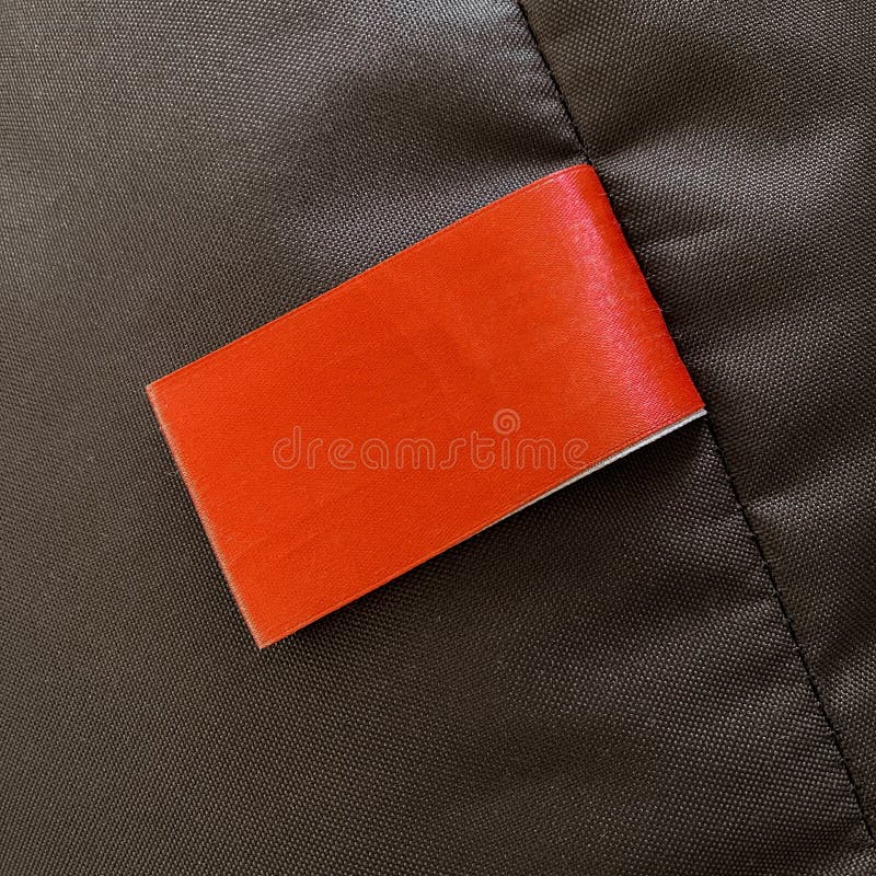 A Red Blank Label on a Brown Garment or Soft Garment Stock Photo ...