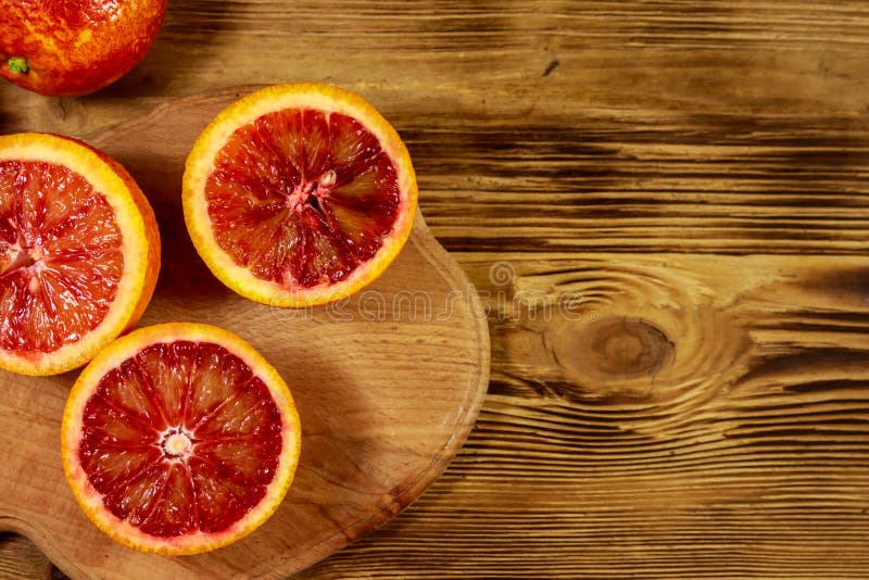 Red Blood Oranges on Wooden Table. Top View Stock Photo - Image of ...