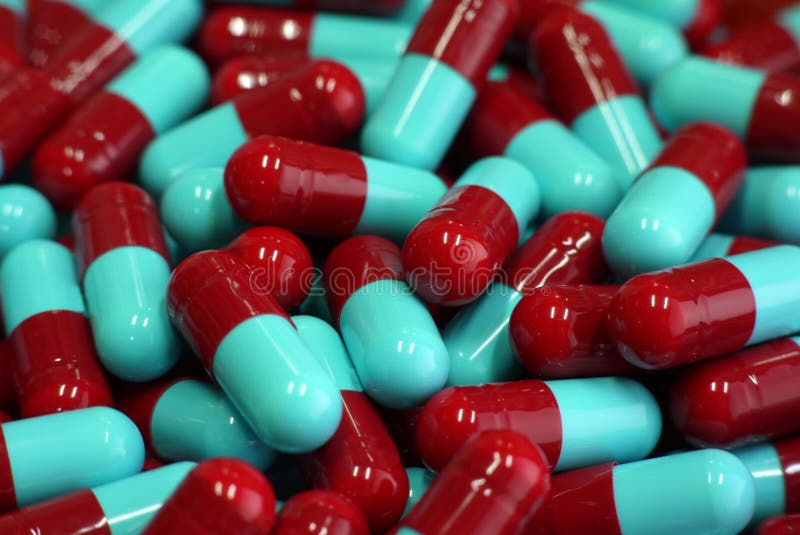 Red And Blue Capsule With Clock Background Stock Image - Image of clock ...