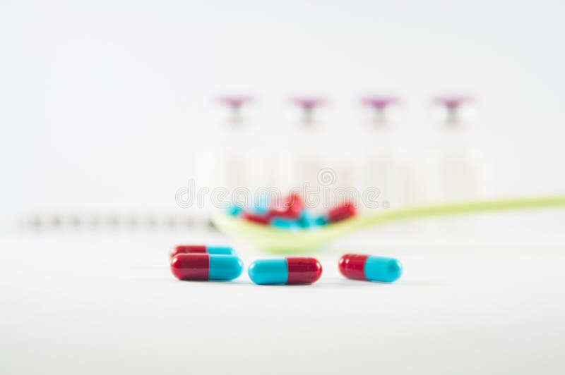 Red and Blue Capsule and Syringe Show Medicine Concept Stock Photo ...