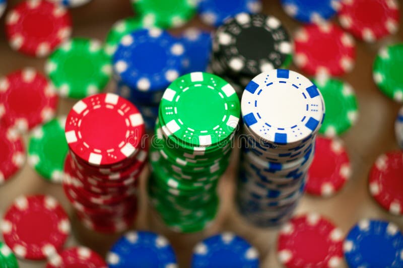 Red, Blue, Green And Black Casino Tokens Stock Photo - Image of game ...