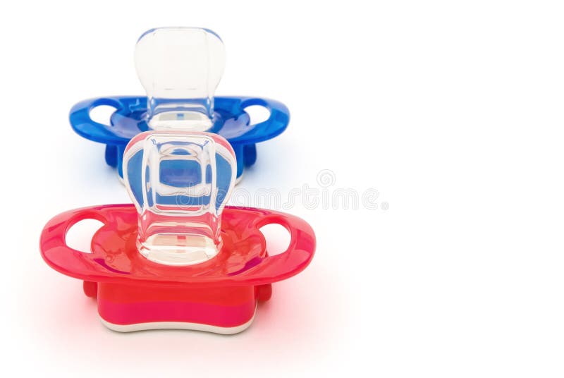 Red and blue pacifiers stock photo. Image of dummy, cradle - 29888112
