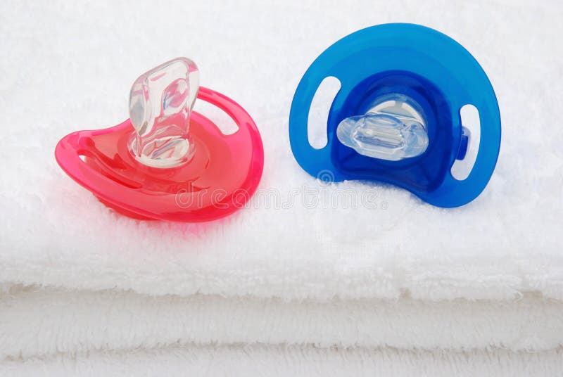 Red and blue pacifiers stock image. Image of mouth, dream - 31231333