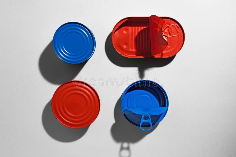 Red and Blue Painted Tin Cans on Gray Background Stock Photo - Image of ...