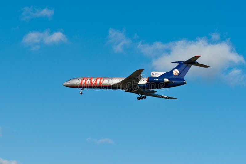 Red-blue plane TU-154 editorial photo. Image of takeoff - 16596546