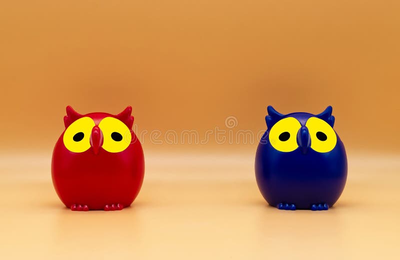 Red and Blue Plastic Owl Toys Isolated on Orange Background Stock Image ...