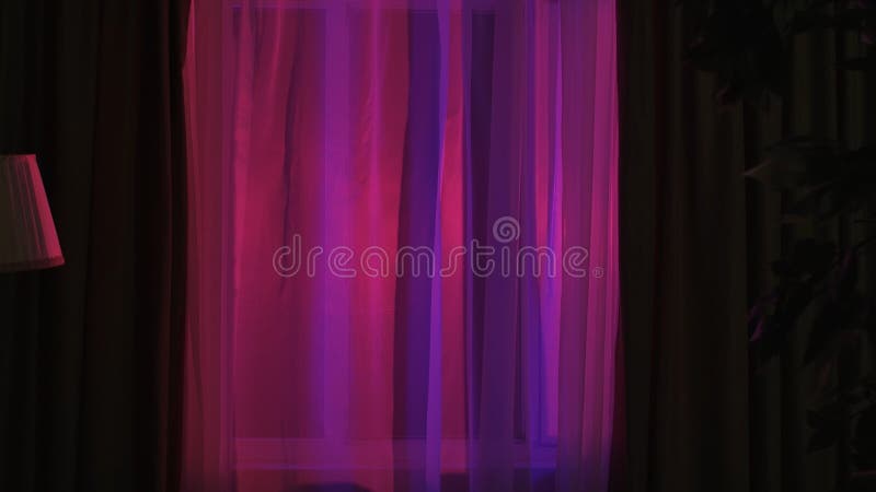 Red and Blue Police Lights Illuminating the Dark Room through the ...