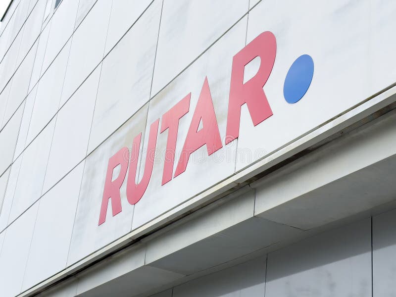 Red and Blue Rutar Sign on White Building Exterior Editorial ...