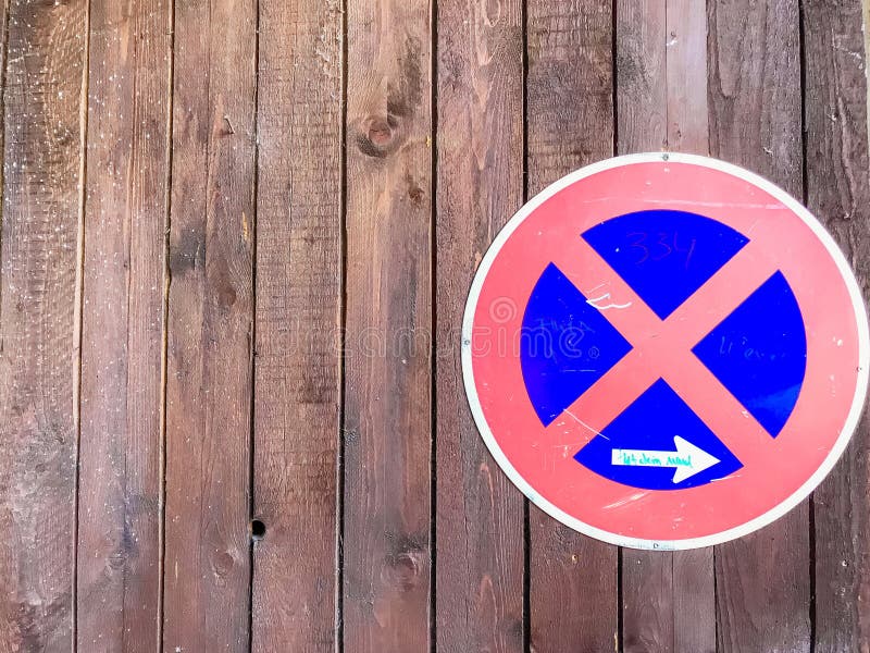 A Red and Blue Sign with an Arrow Pointing To the Right Stock Photo ...