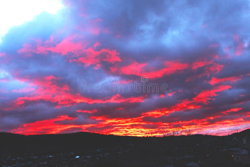 Red-blue Sunset Over the City is Covered with Clouds. City Silhouette ...