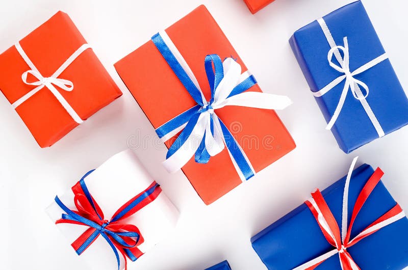 Red, Blue and White Gift Boxes with Ribbons on a White Background Stock ...