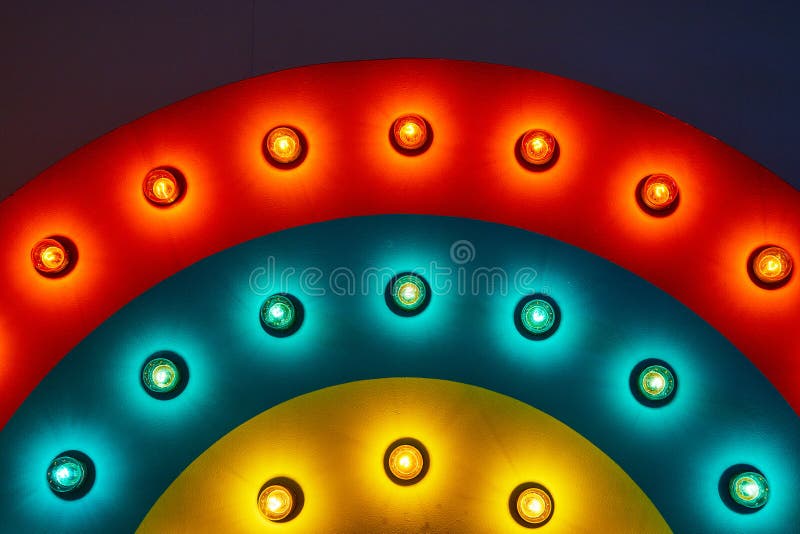 Red, Blue, and Yellow Rings of Light on Rainbow Wave Art Piece Stock ...