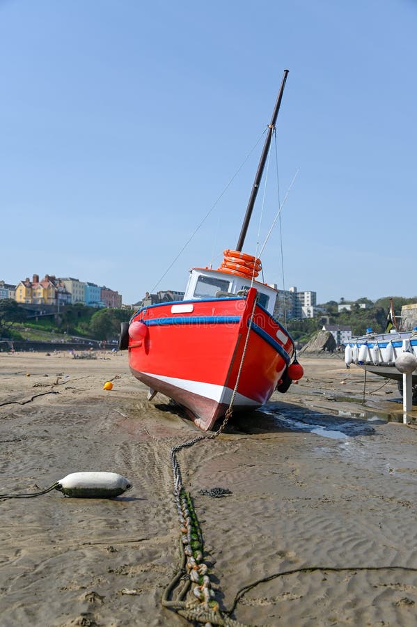 Red Boat at Low Tide in Tenby Harbour Stock Image - Image of buildings ...