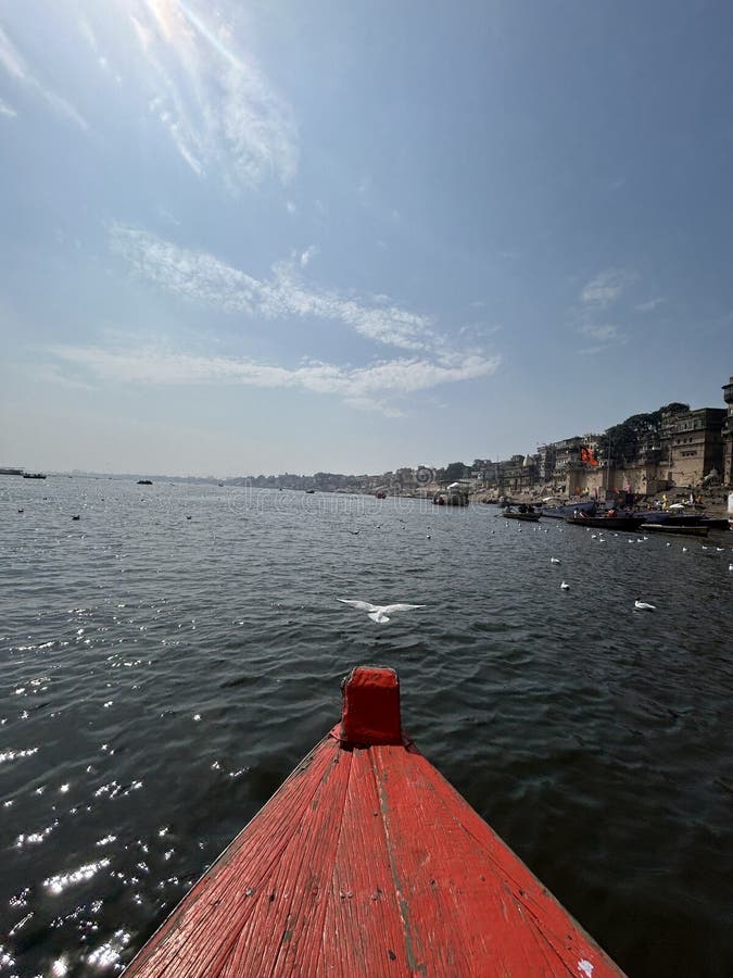Red Boat Floats on a Vast, Tranquil Body of Water Stock Image - Image of water, surface: 320382719