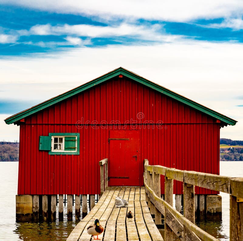 Red Boat House and Bridge with Ducks Stock Photo - Image of residential ...
