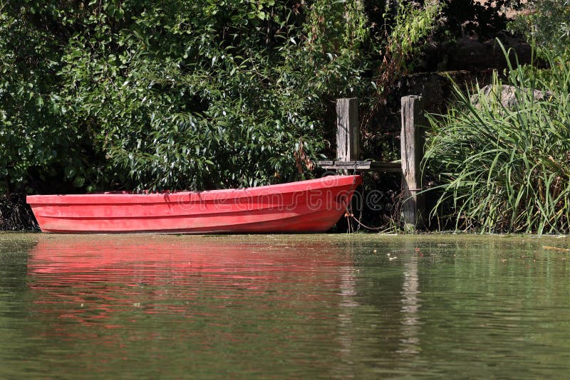 Red boat near the lake stock photo. Image of adventure - 254558182