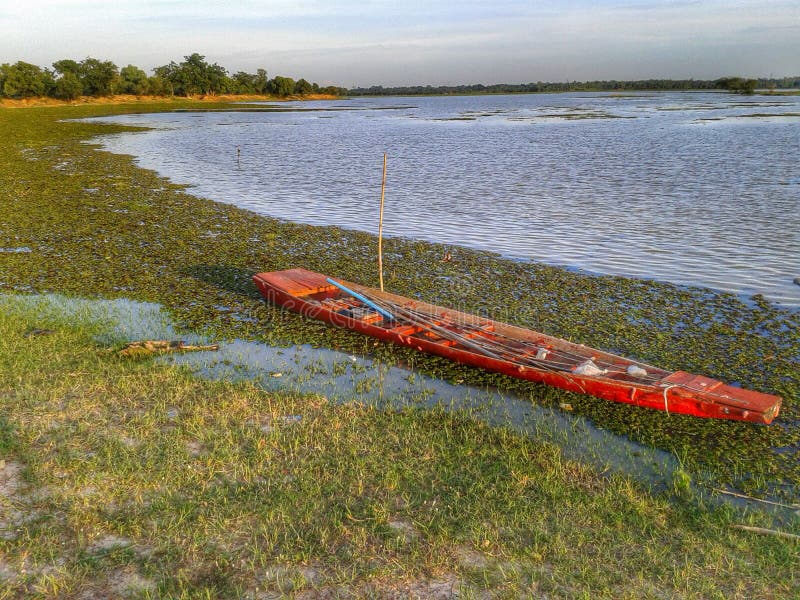 Red boat the sunset stock image. Image of wetland, coast - 42651465