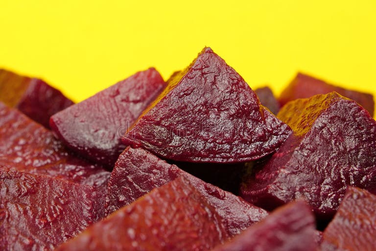Red Boiled Beetroot Cut into Pieces on Yellow Background Stock Photo ...