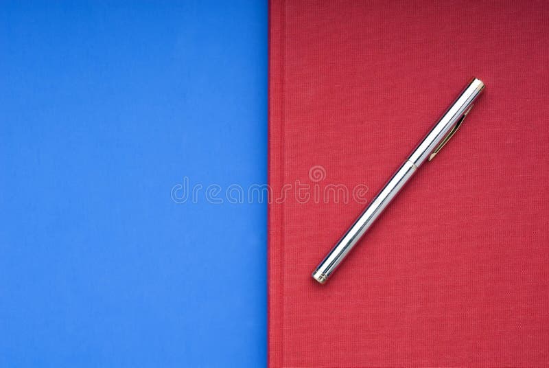 Red Book on a Blue Background Stock Image - Image of blue, silver: 4270267