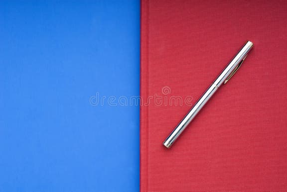 Red Book on a Blue Background Stock Image - Image of blue, silver: 4270267