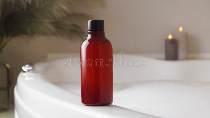 Red Bottle of Bubble Bath on Tub Indoors, Space for Text Stock Image ...