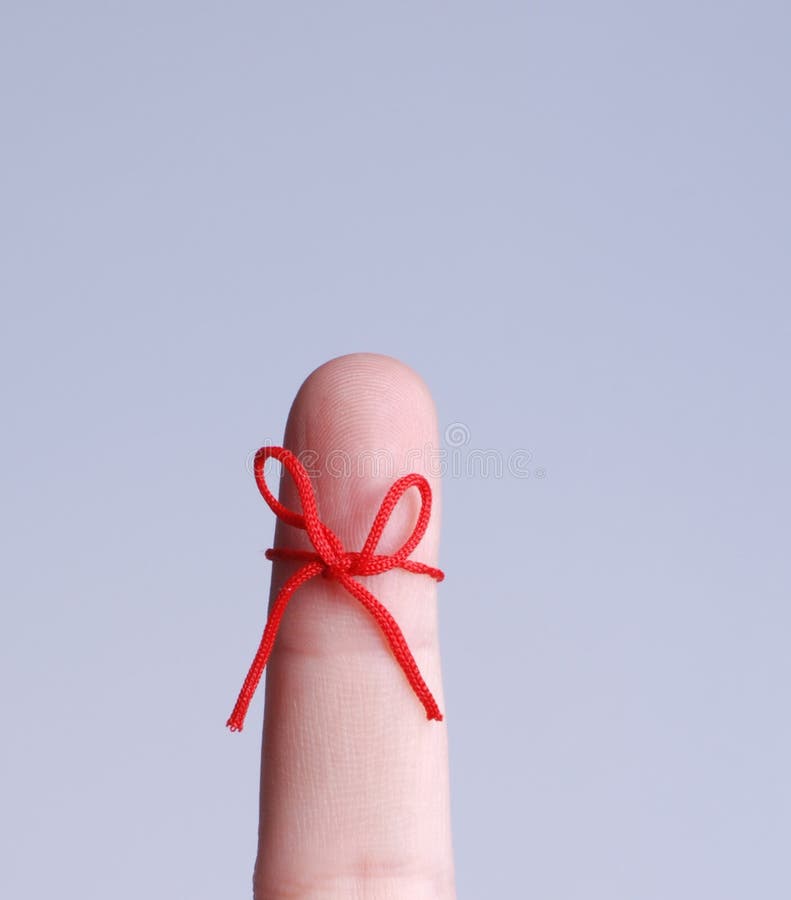 Red bow on finger stock image. Image of contemplation - 8439181