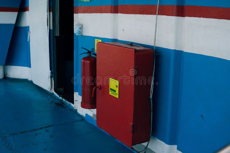Red Box and a Fire Extinguisher on a Ferry Ship Stock Photo - Image of ...